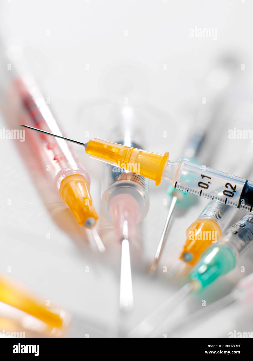 Syringes on white background Stock Photo - Alamy