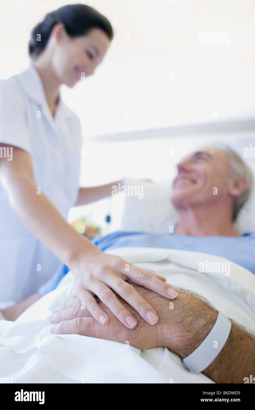 Patient attending to senior hospital hi-res stock photography and ...