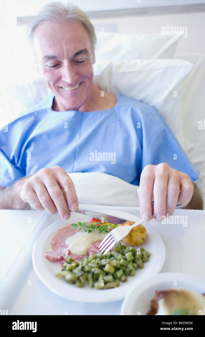 Hospital patient eating dinner hi-res stock photography and images - Alamy
