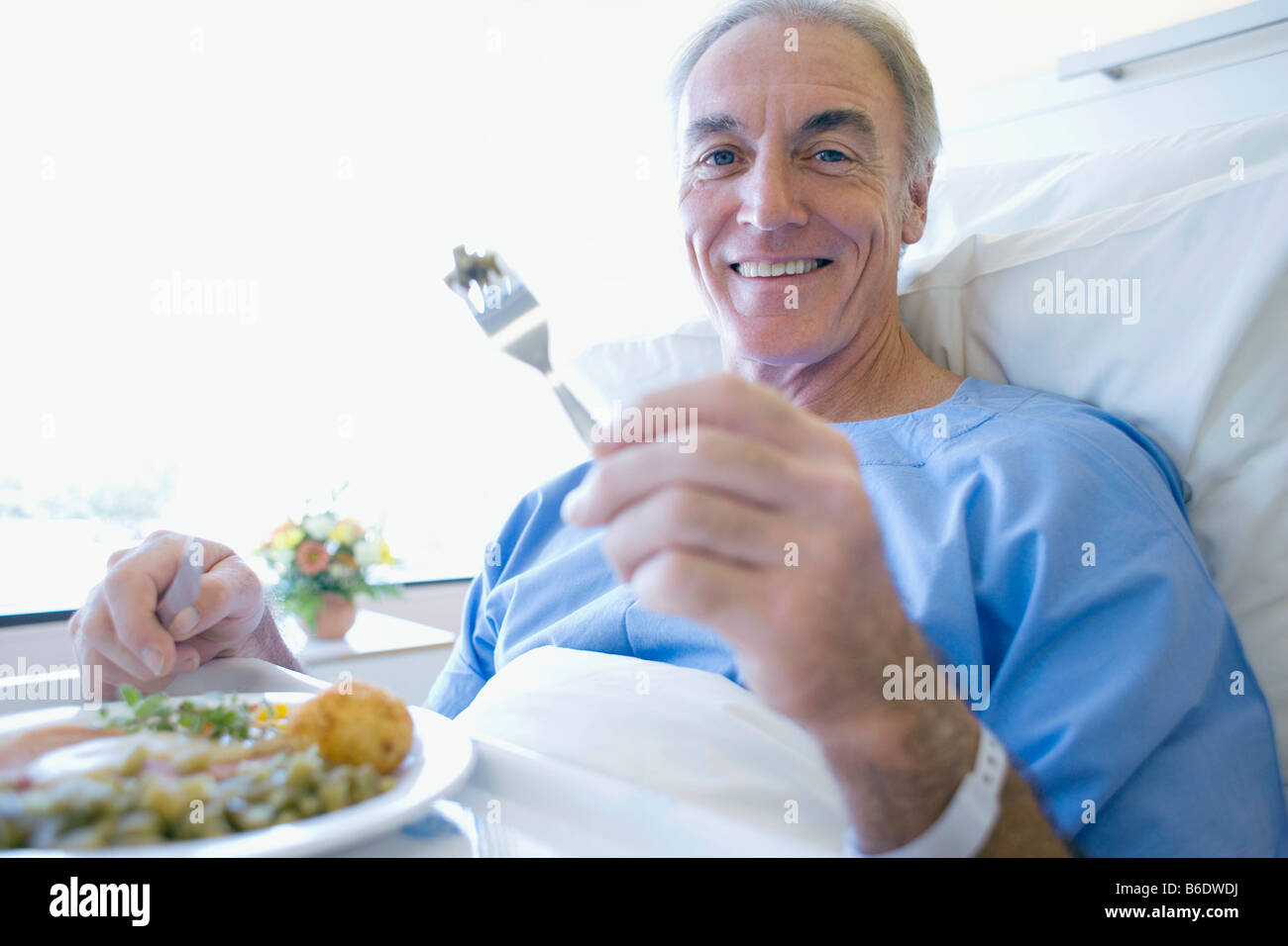 Hospital patient eating dinner hi-res stock photography and images - Alamy
