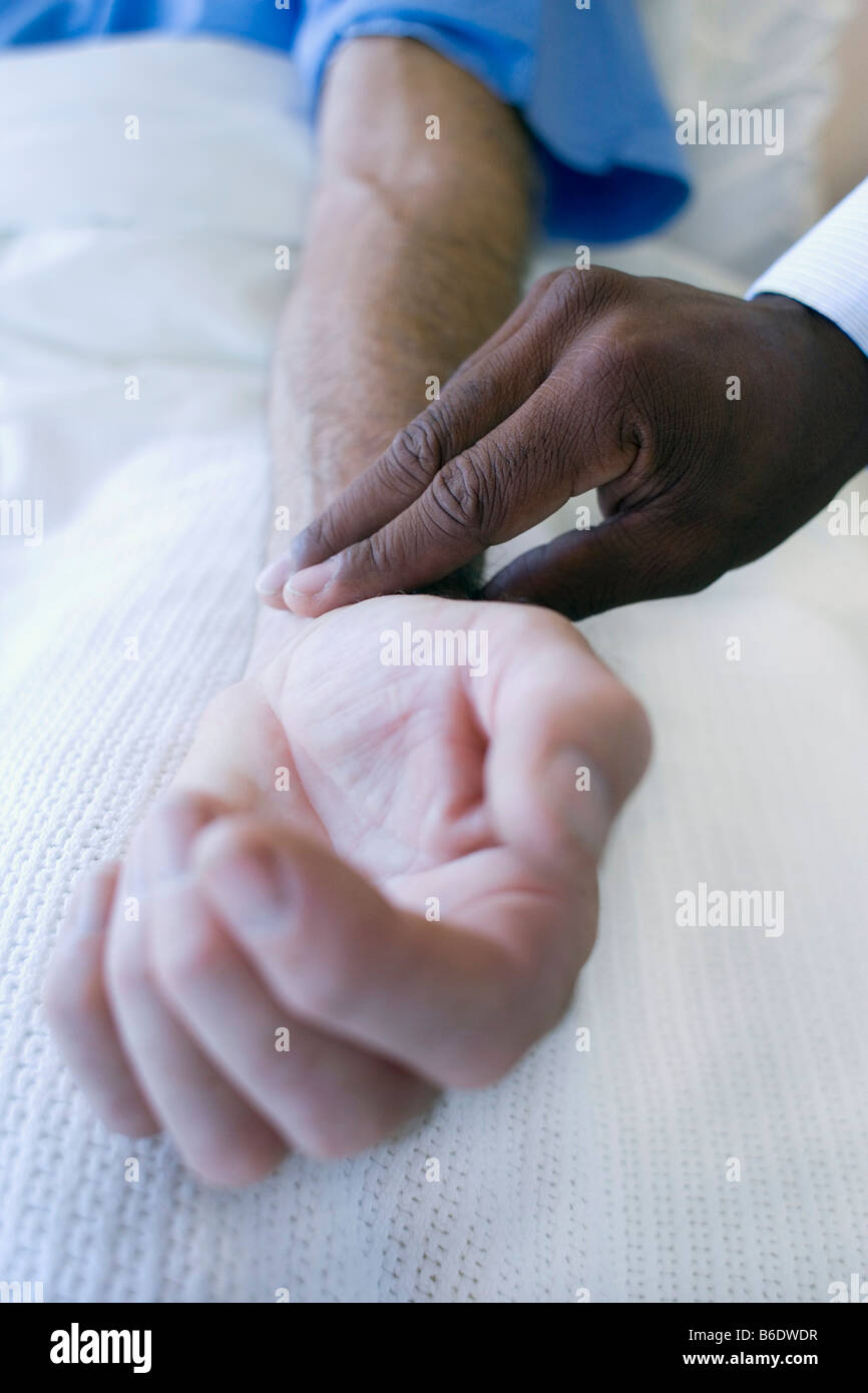 Caribbean doctor pulse rate hi-res stock photography and images - Alamy