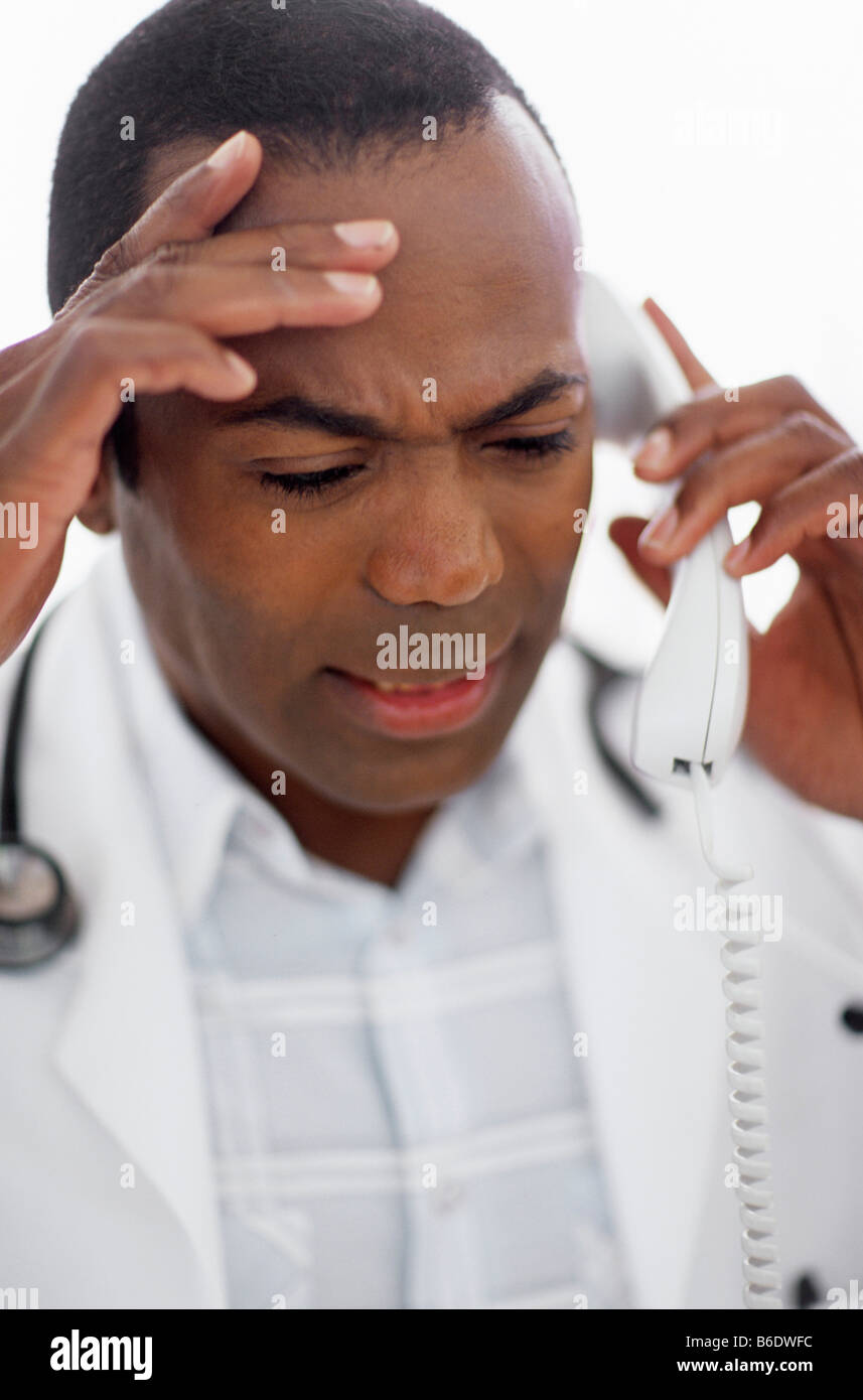Male doctor making a telephone call Stock Photo - Alamy