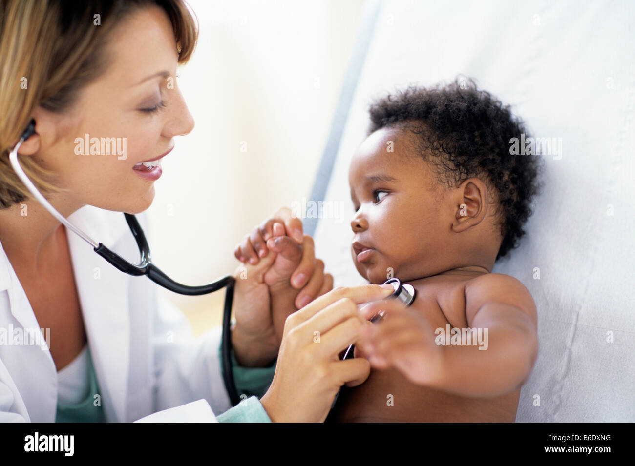 Paediatric examination. Health of a 12-week-old baby girl being checked ...
