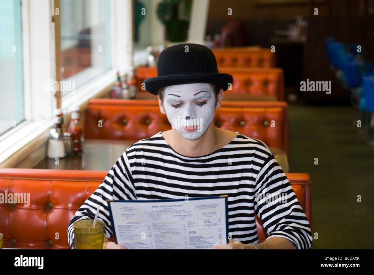 Young man, painted face, mime, smiling Stock Photo - Alamy