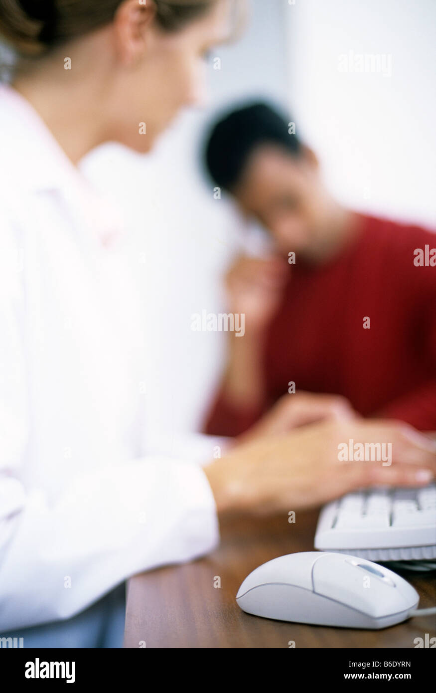 Male patient consulting his general practioner (GP).The patient may be ...