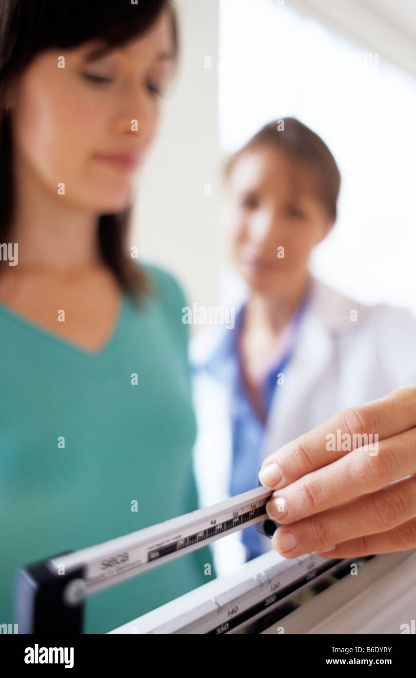 Patient standing on weighing scale hi-res stock photography and images ...