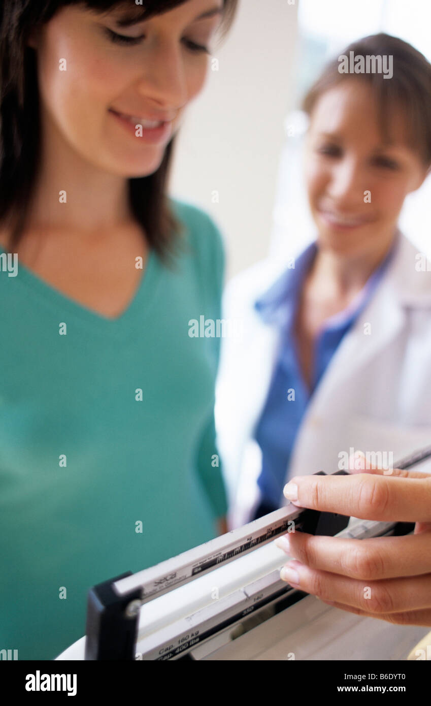 Patient standing on weighing scale hi-res stock photography and images ...
