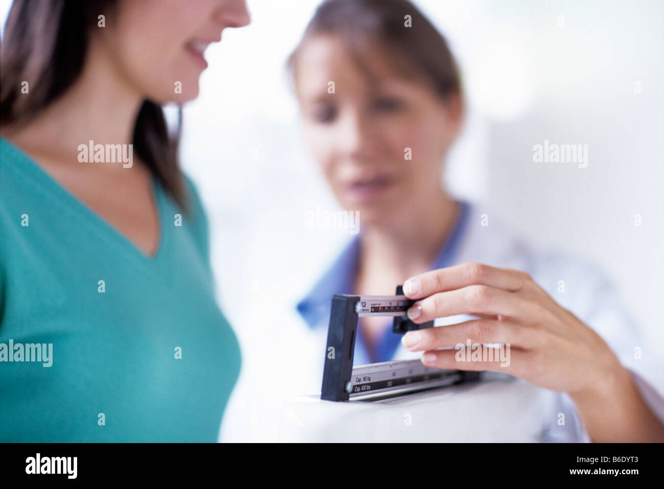 Hand adjusting weight scales hi-res stock photography and images - Alamy
