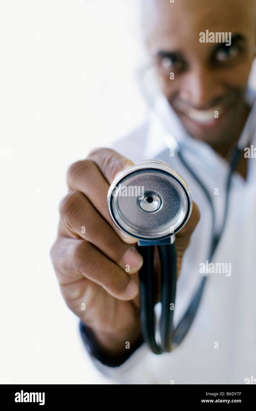 Doctor holding a stethoscope. The stethoscope allows the doctor to ...