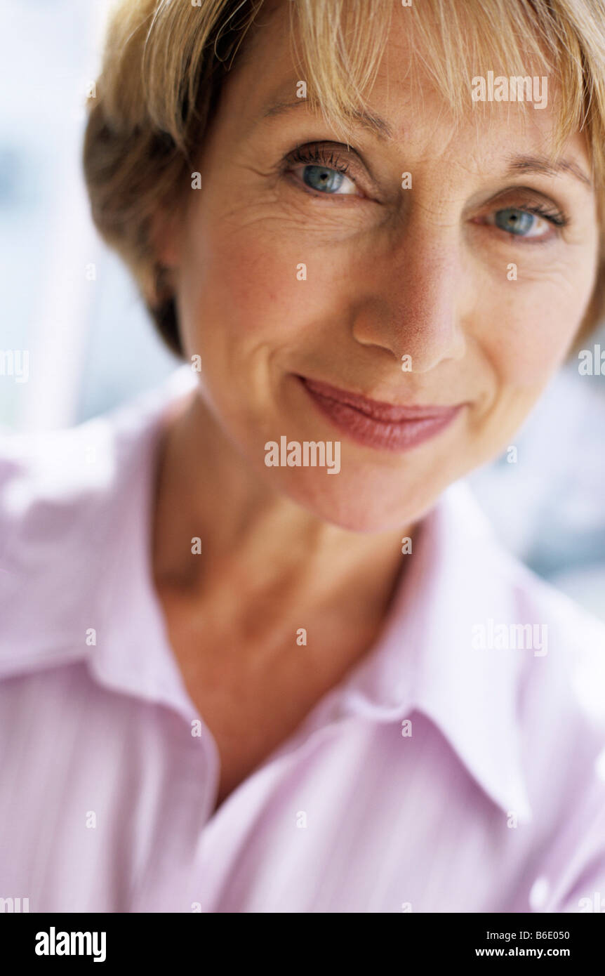 Smiling woman. 47 year oldwoman looking happy Stock Photo - Alamy