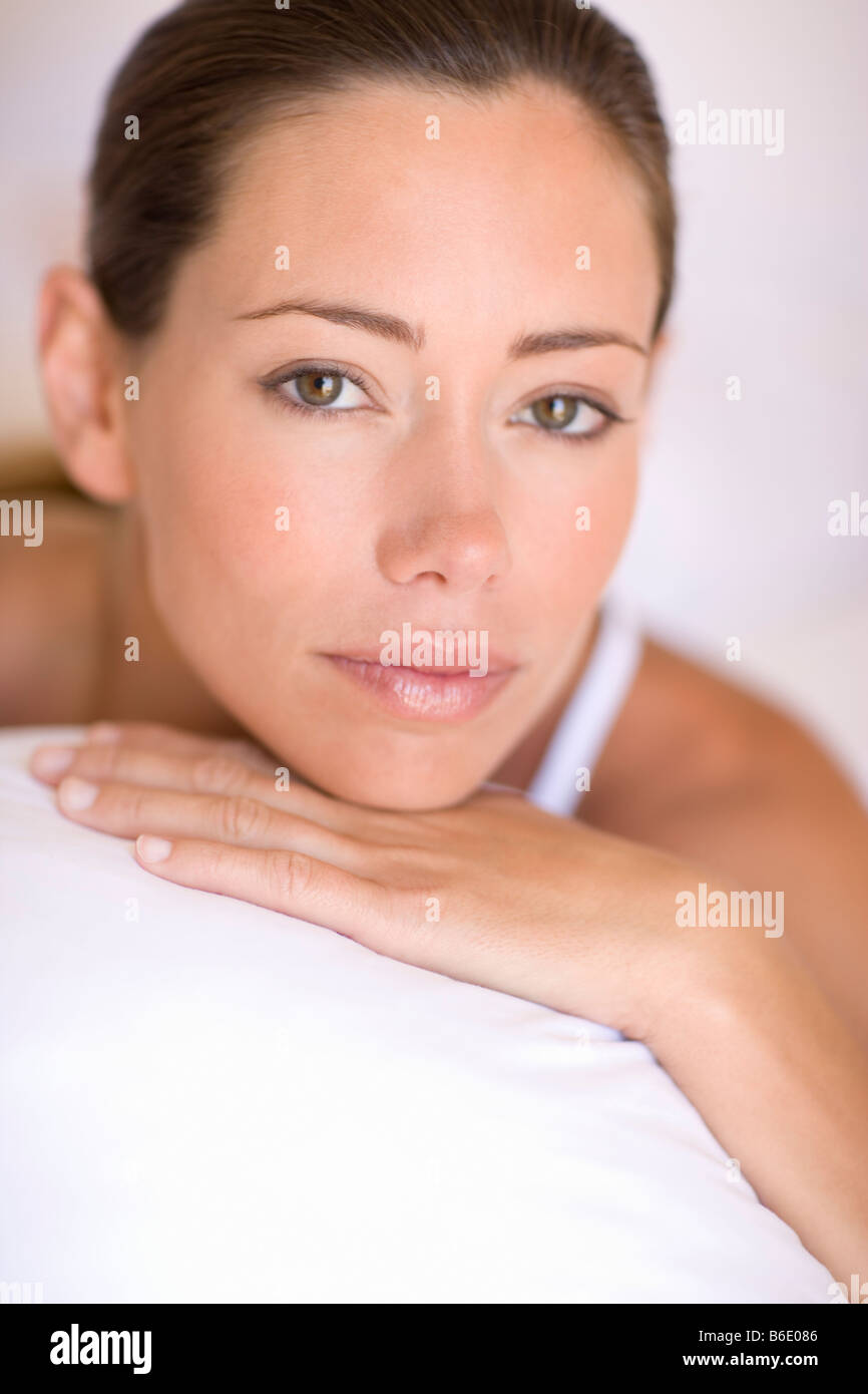 Healthy woman resting her head on her hand Stock Photo - Alamy