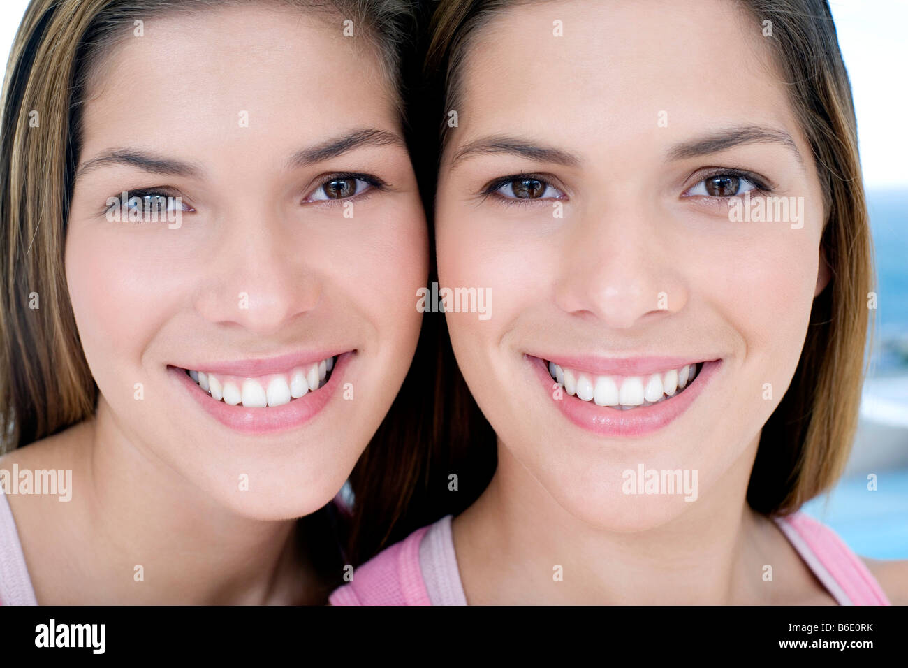 Two identical faces side by side hi-res stock photography and images ...