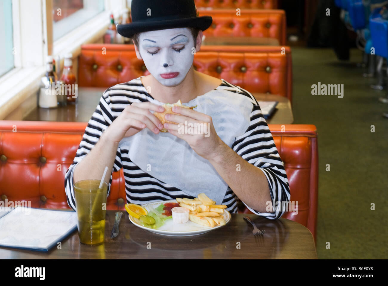 Young man, painted face, mime, smiling Stock Photo - Alamy