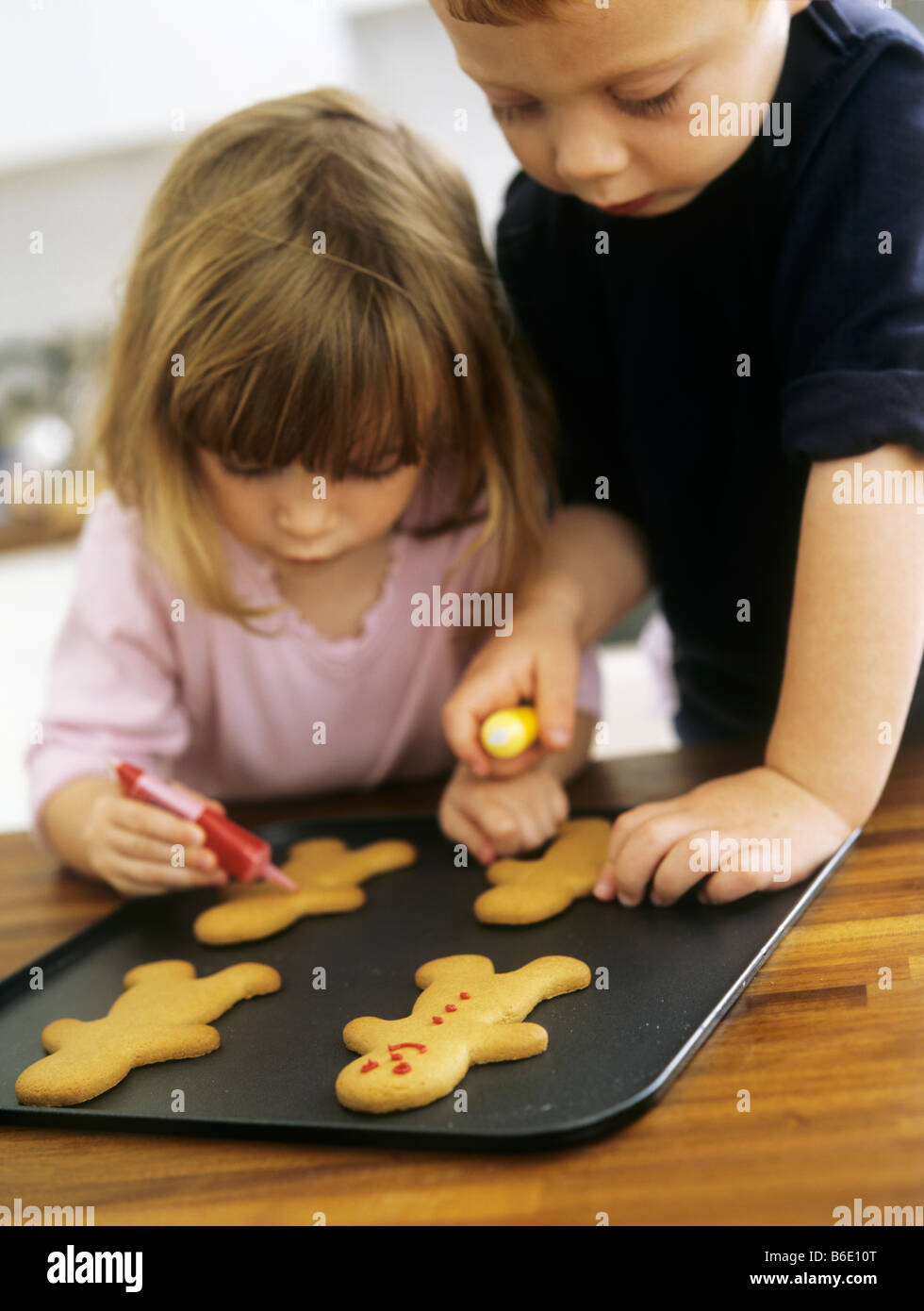 Boy girl baking concentrating hi-res stock photography and images - Alamy