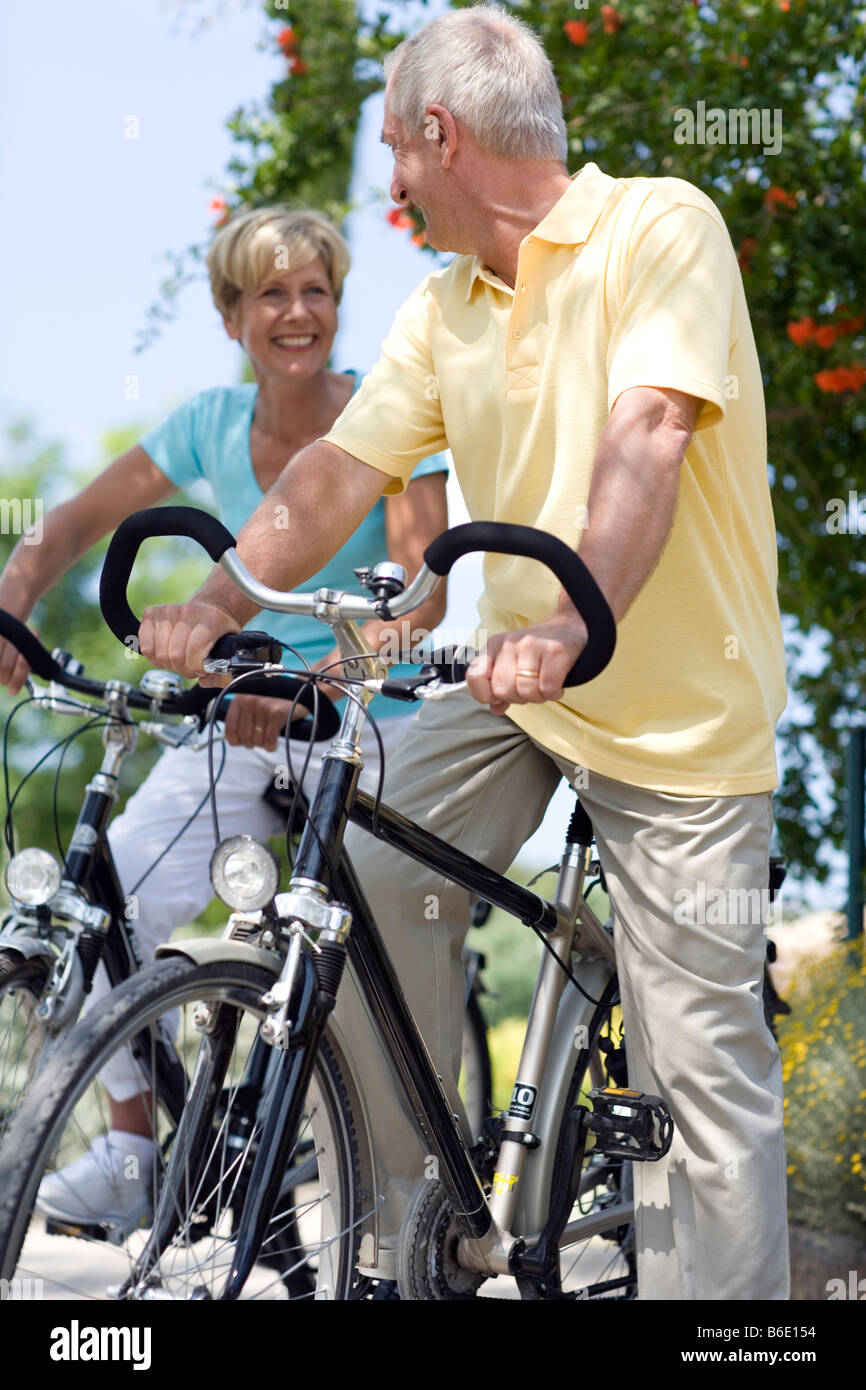 Cyclists. Smiling couple enjoying a cycle ride in the countryside Stock ...