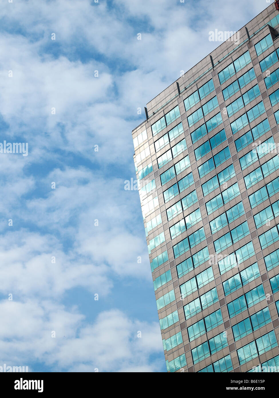 Clouds reflected on exterior glass panels of building Stock Photo - Alamy