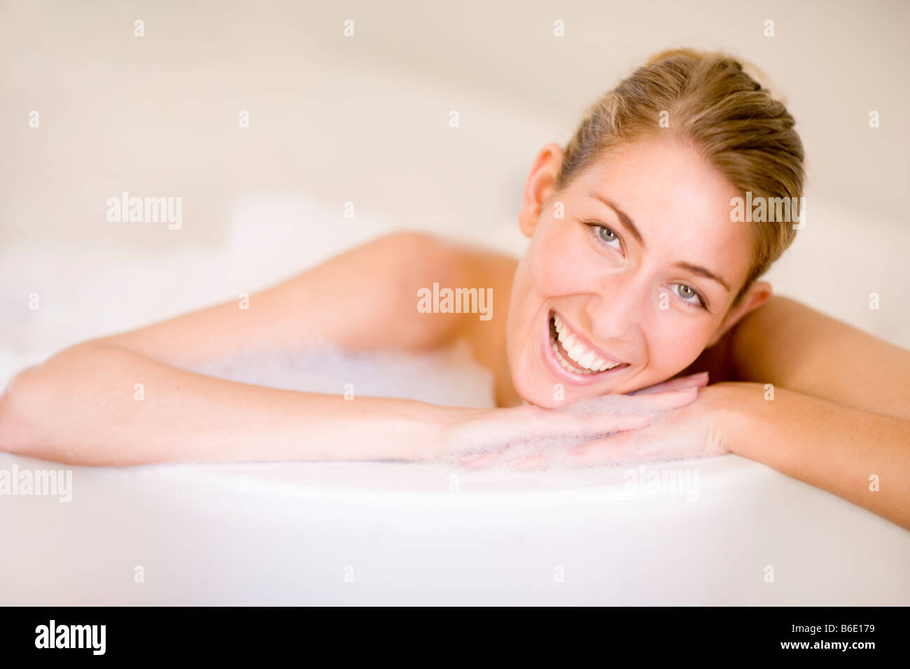 Woman relaxing in a bath Stock Photo - Alamy