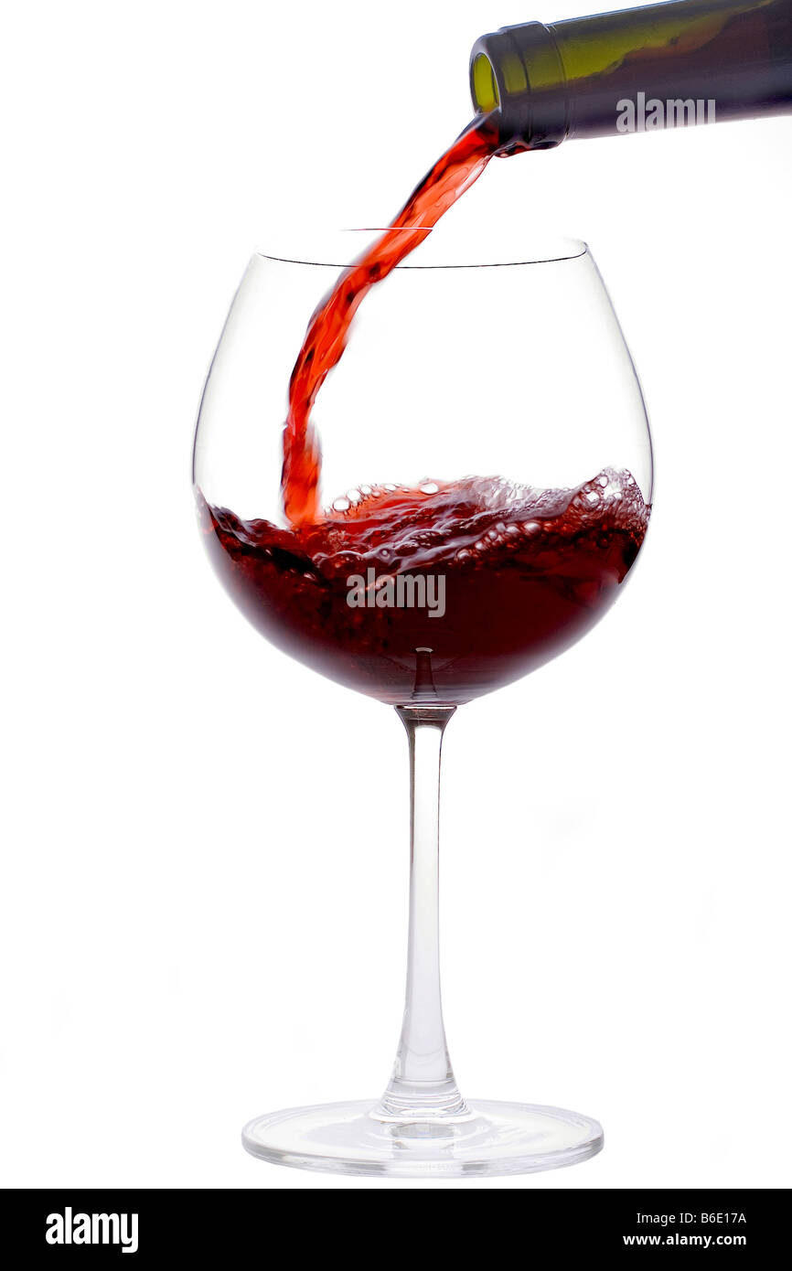 red wine flow in a transparent glass Stock Photo - Alamy