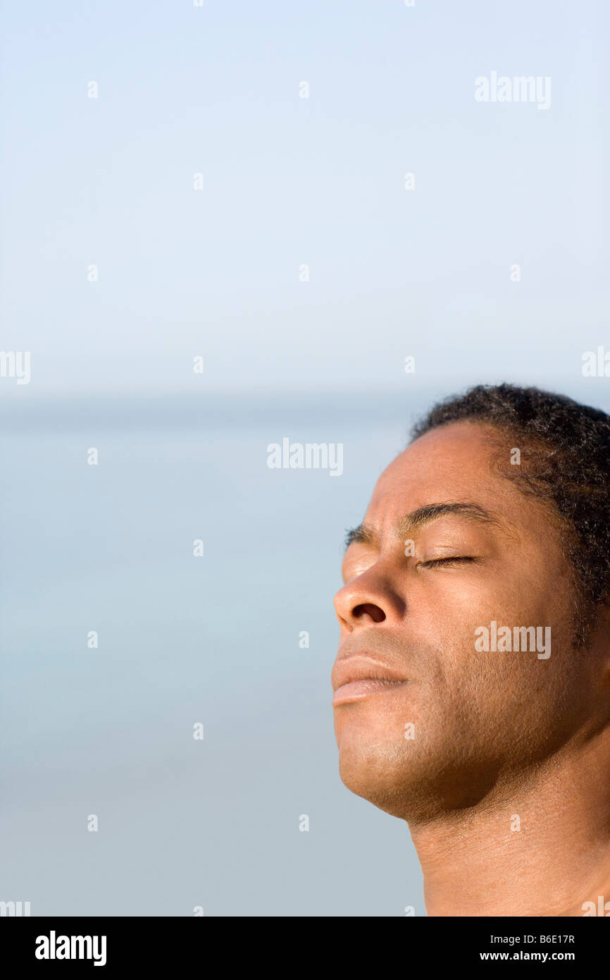 Man sunbathing on a beach Stock Photo - Alamy