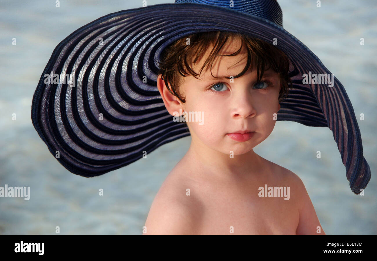A little boy in a big blue hat Stock Photo - Alamy