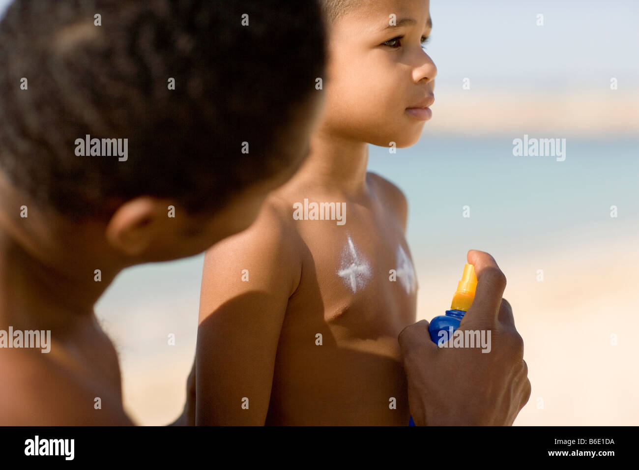 Applying sun cream to kids hi-res stock photography and images - Alamy