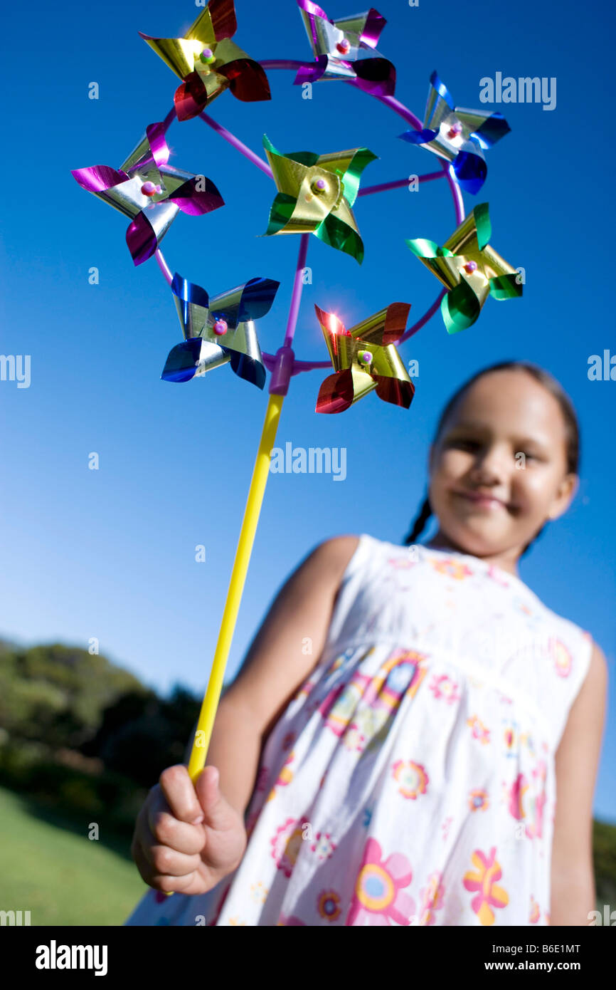 Kid girl blowing windmill hi-res stock photography and images - Alamy