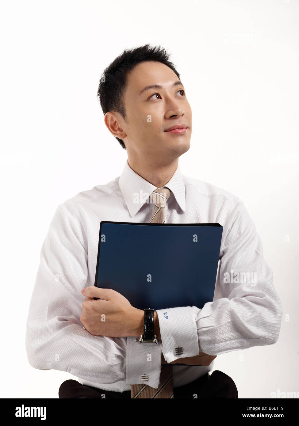 Businessman holding file Stock Photo - Alamy Businessman holding file Stock Photo - Alamy