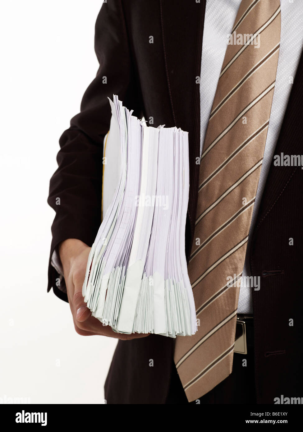 Businessman carrying paperwork Stock Photo - Alamy