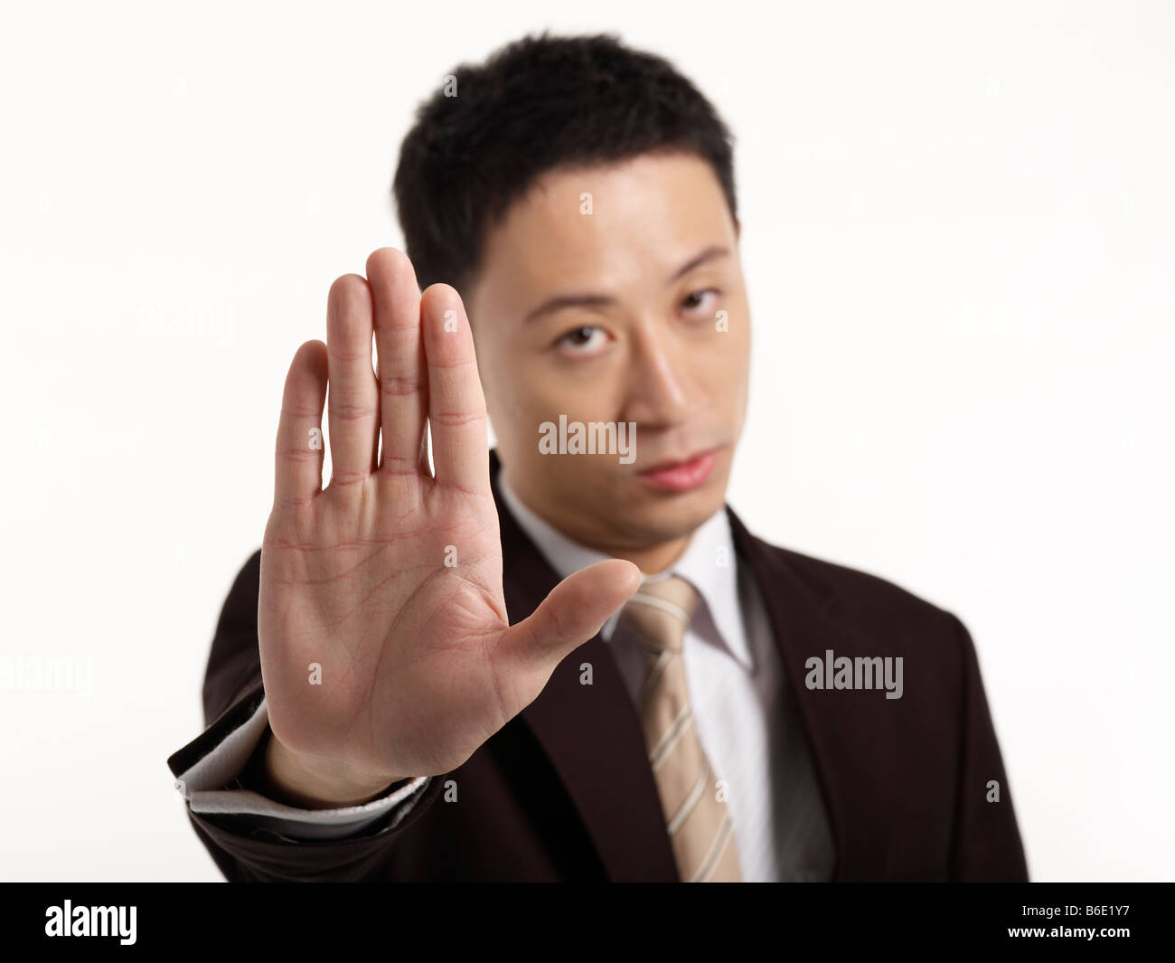 Businessman raising his hand Stock Photo - Alamy