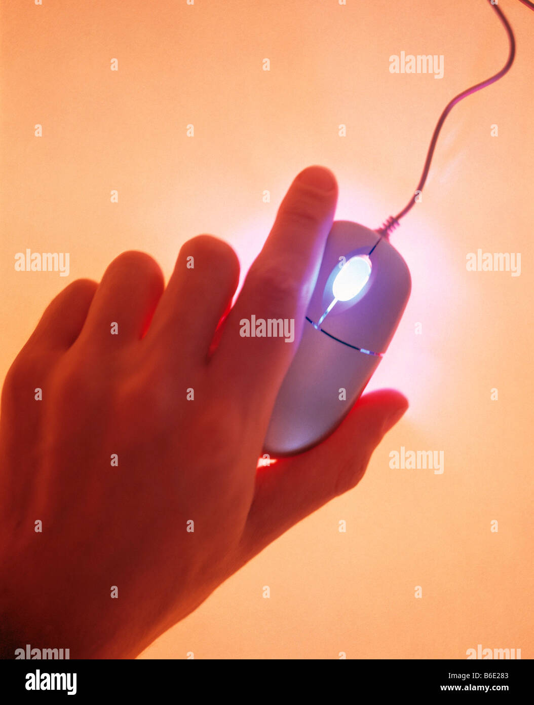 Computer mouse. Conceptual image showing a hand using a glowing ...