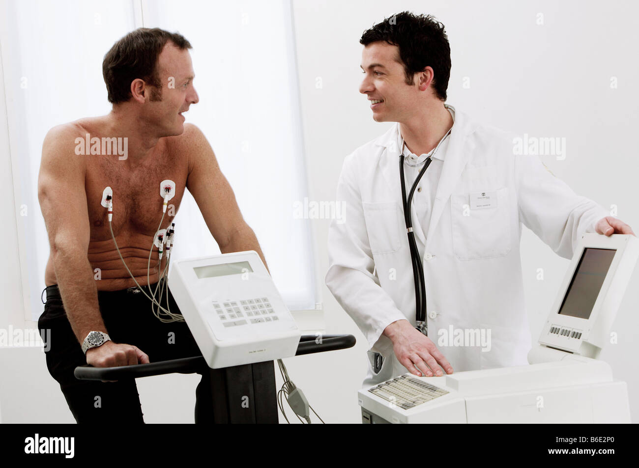 Heart fitness test. Doctor discussing test results with a patient Stock ...