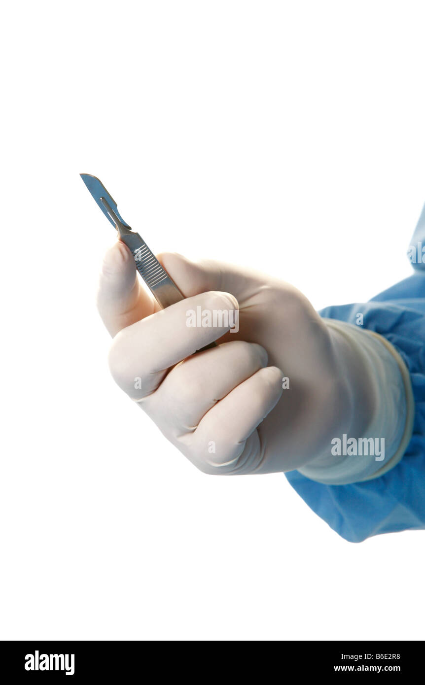 Scalpel. Surgeon holding a scalpelduring an operation Stock Photo - Alamy