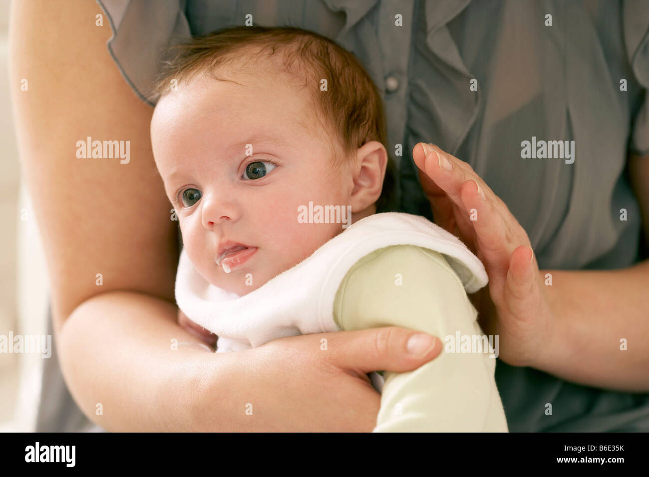 Mother winding baby Stock Photo - Alamy
