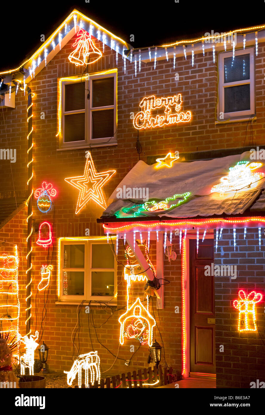 Residential House At Night Lit Up illuminated With Christmas Lights ...