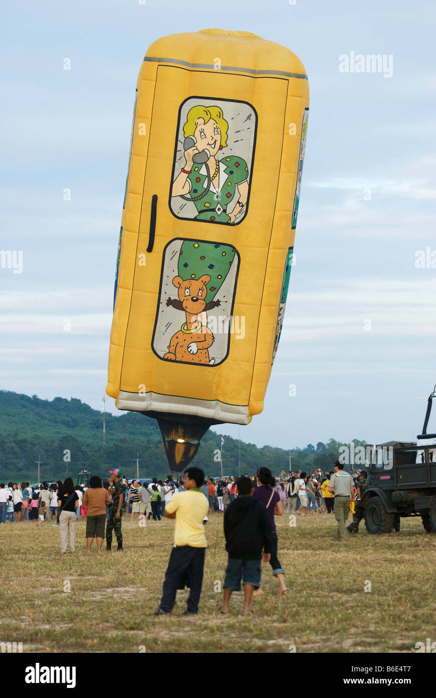 Hot air balloon shaped as a yellow telephone booth Stock Photo - Alamy