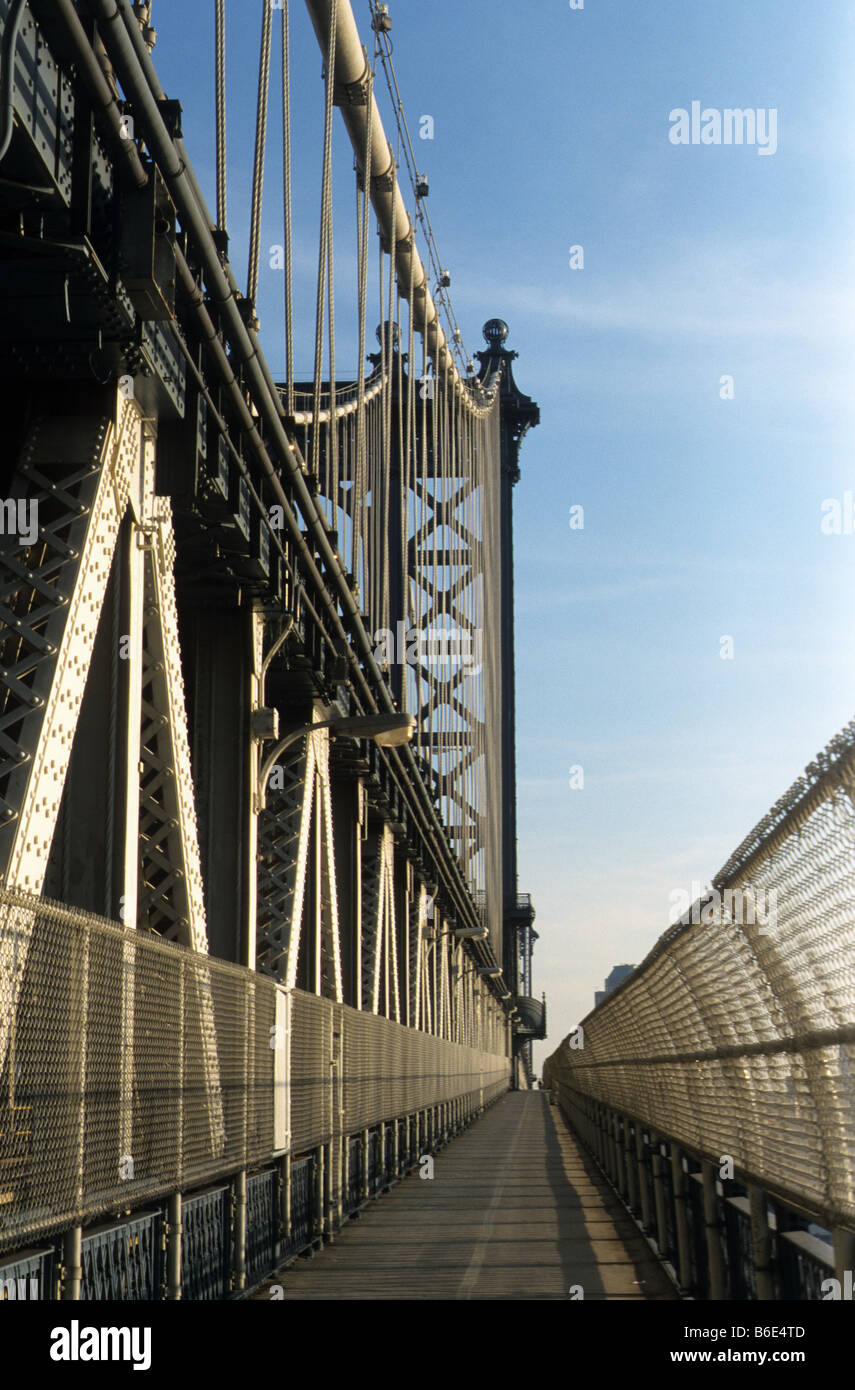 New York, Helicopter flying over Manhattan Bridge, seen from pedestrian ...