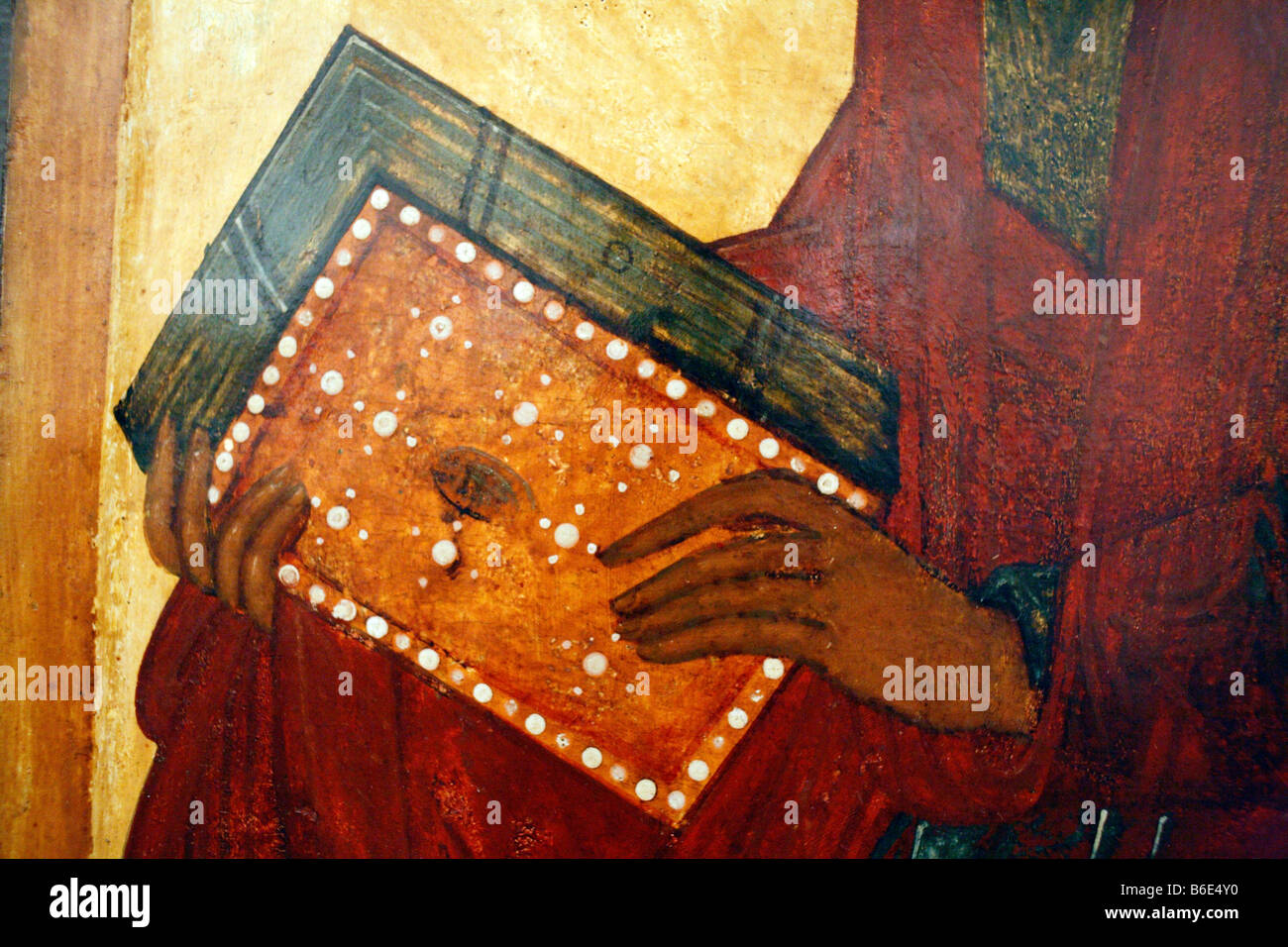 Hand with book, detail of Russian Icon, religious art, saint, city ...