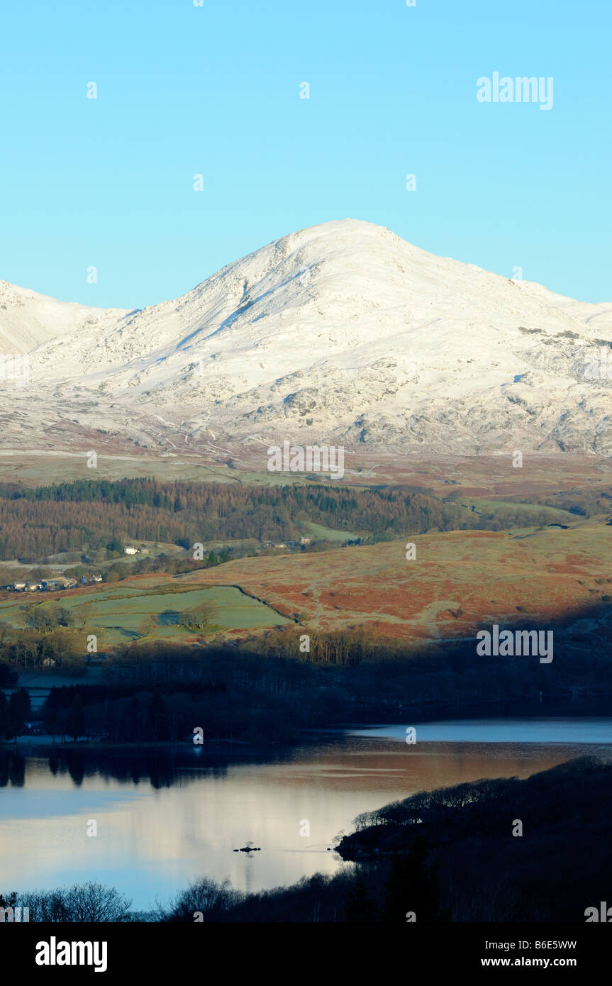 A scenic view of Coniston Water and The Old Man of Coniston covered in ...