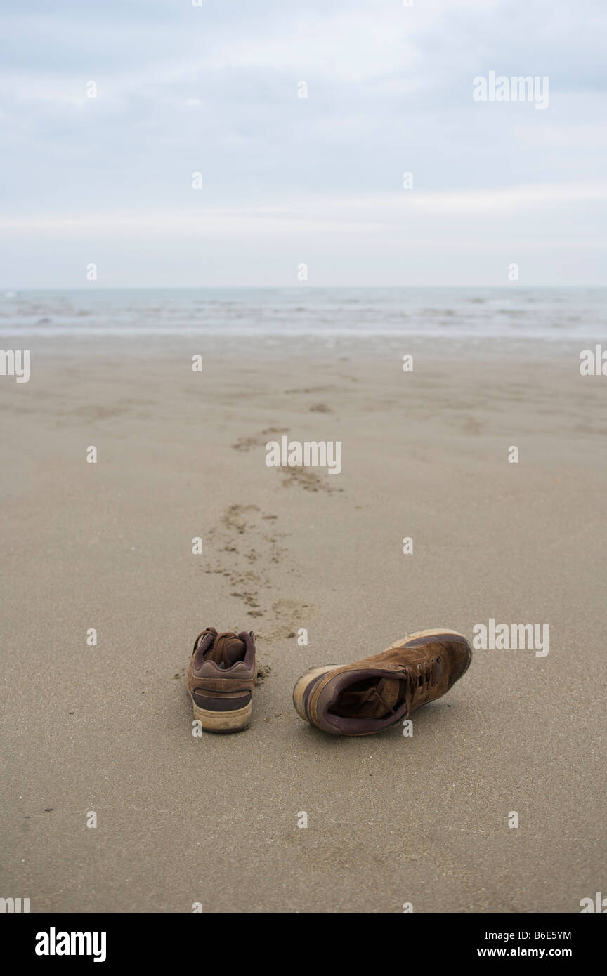 shoes left on a beach, poppit sands, wales, UK Stock Photo - Alamy