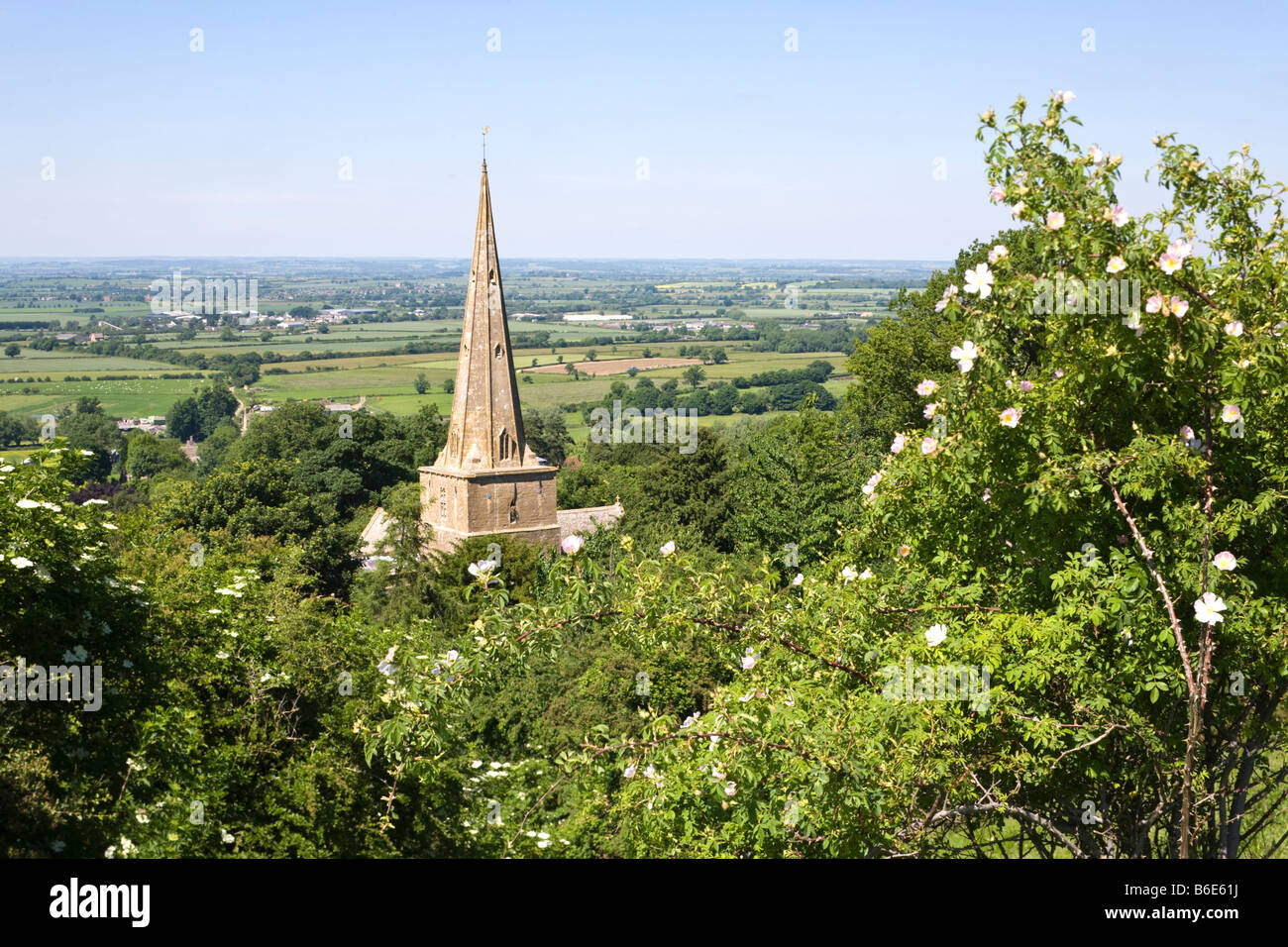 Looking across St Nicholas church in the Cotswold village of Saintbury ...