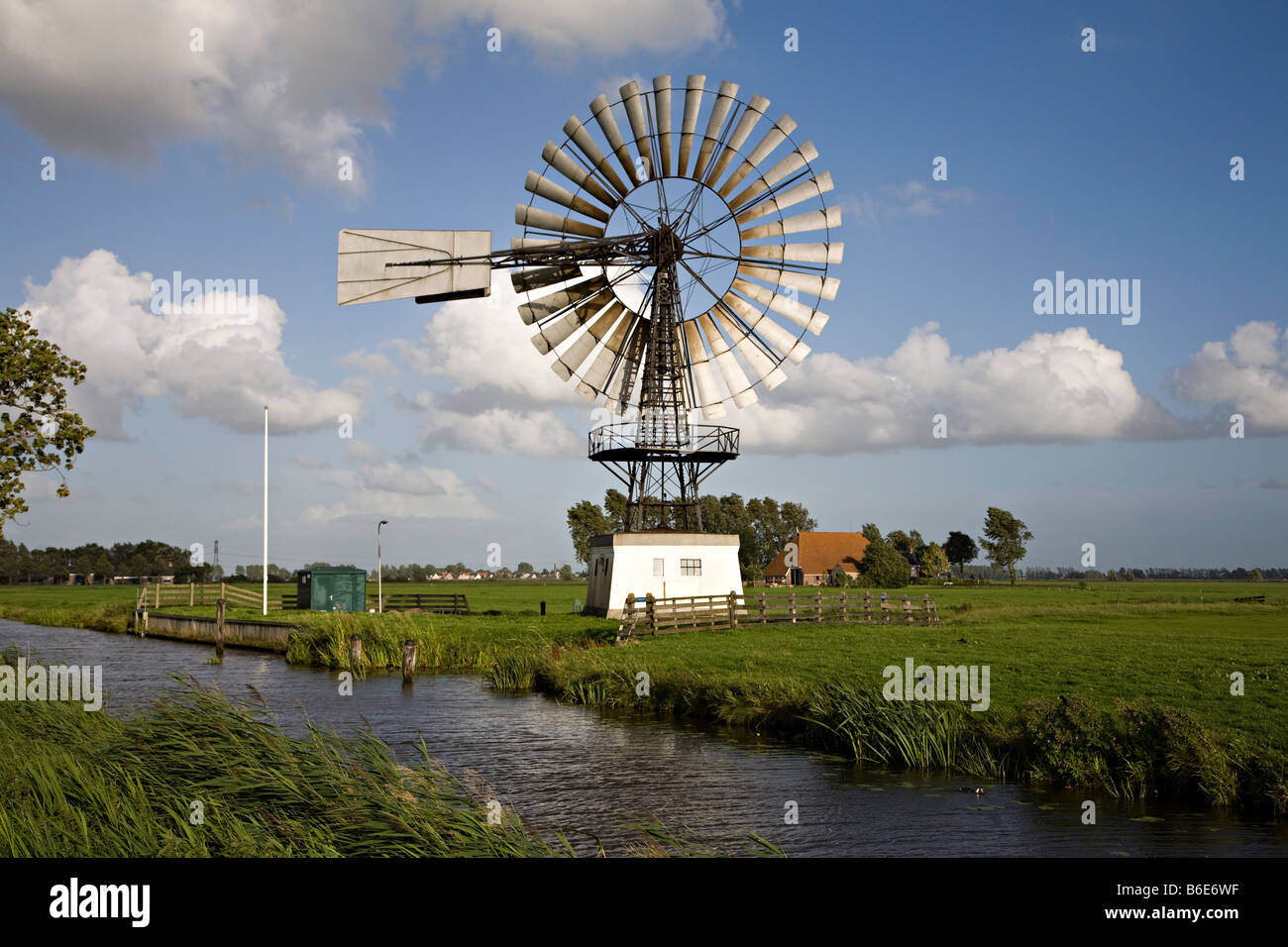 Windmill farm pump on canal Weidum Netherlands Stock Photo - Alamy