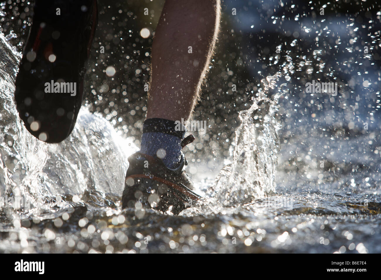 Feet running through puddle hi-res stock photography and images - Alamy
