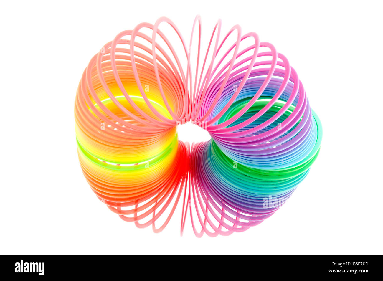 object on white spiral spring toy Stock Photo - Alamy
