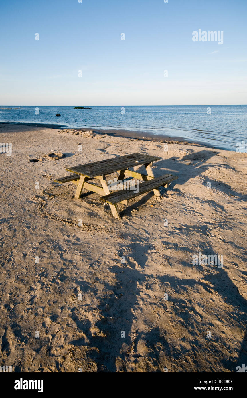 Bench and table at the seaside Stock Photo - Alamy