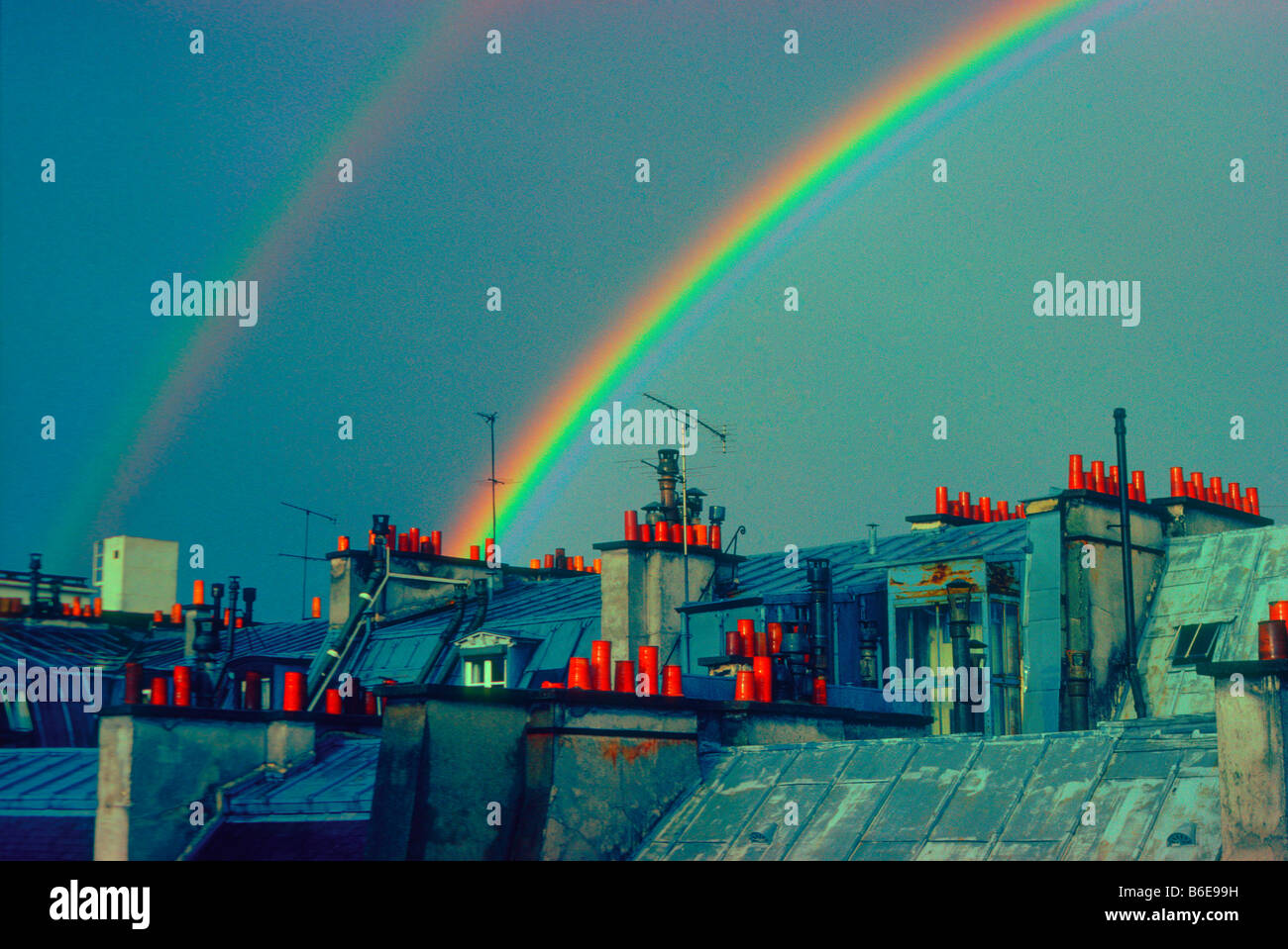 Double rainbow over Paris roofs Stock Photo - Alamy