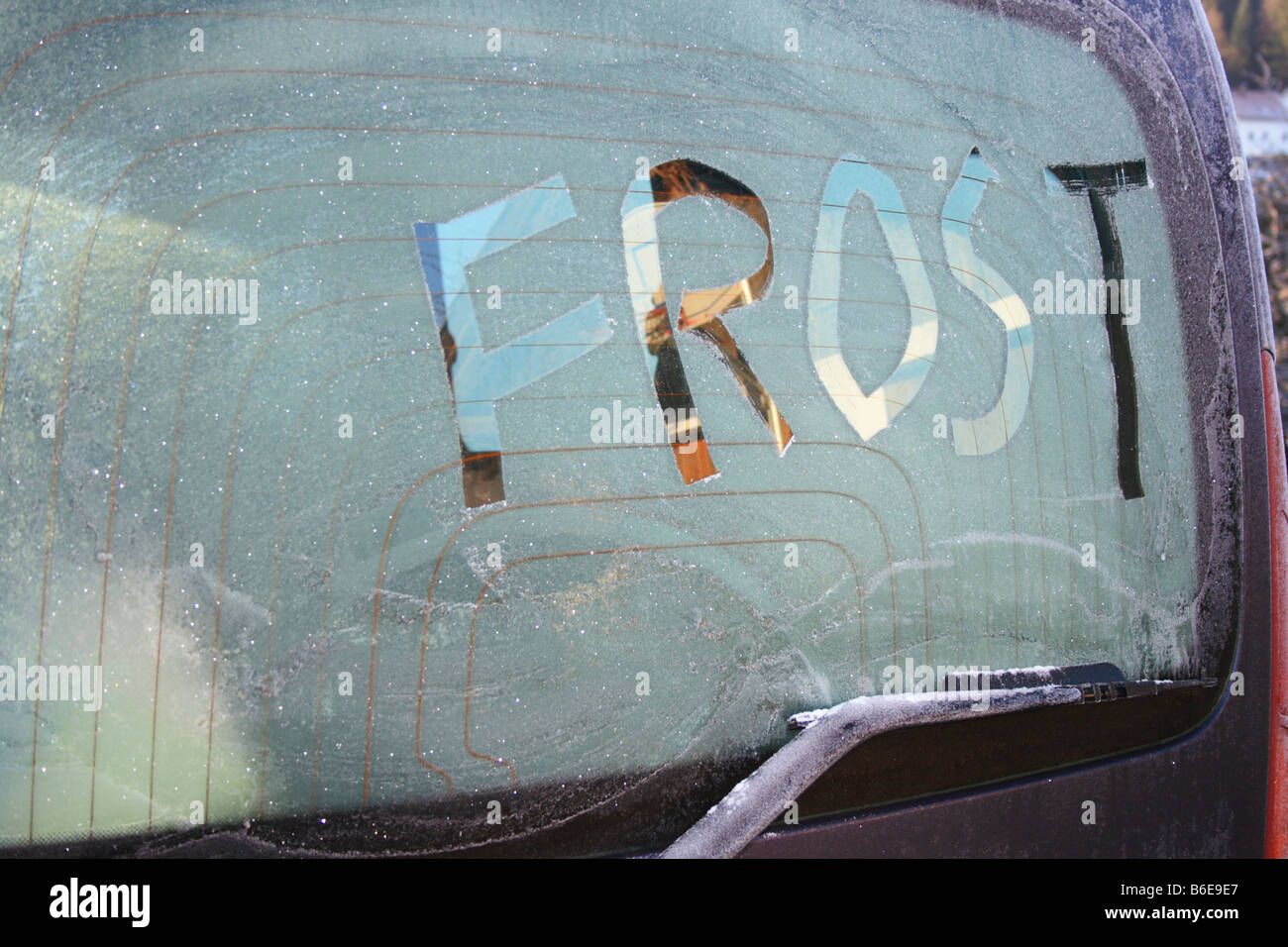 word "FROST" written on frozen rear window of a car. Photo by Willy ...