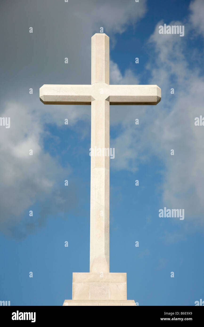 white stone cross on blue sky and cloudy background Stock Photo - Alamy