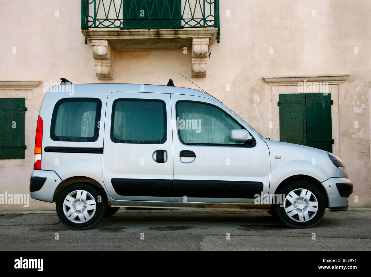 Metallic utility van parked in front of mediterranean house Stock Photo ...