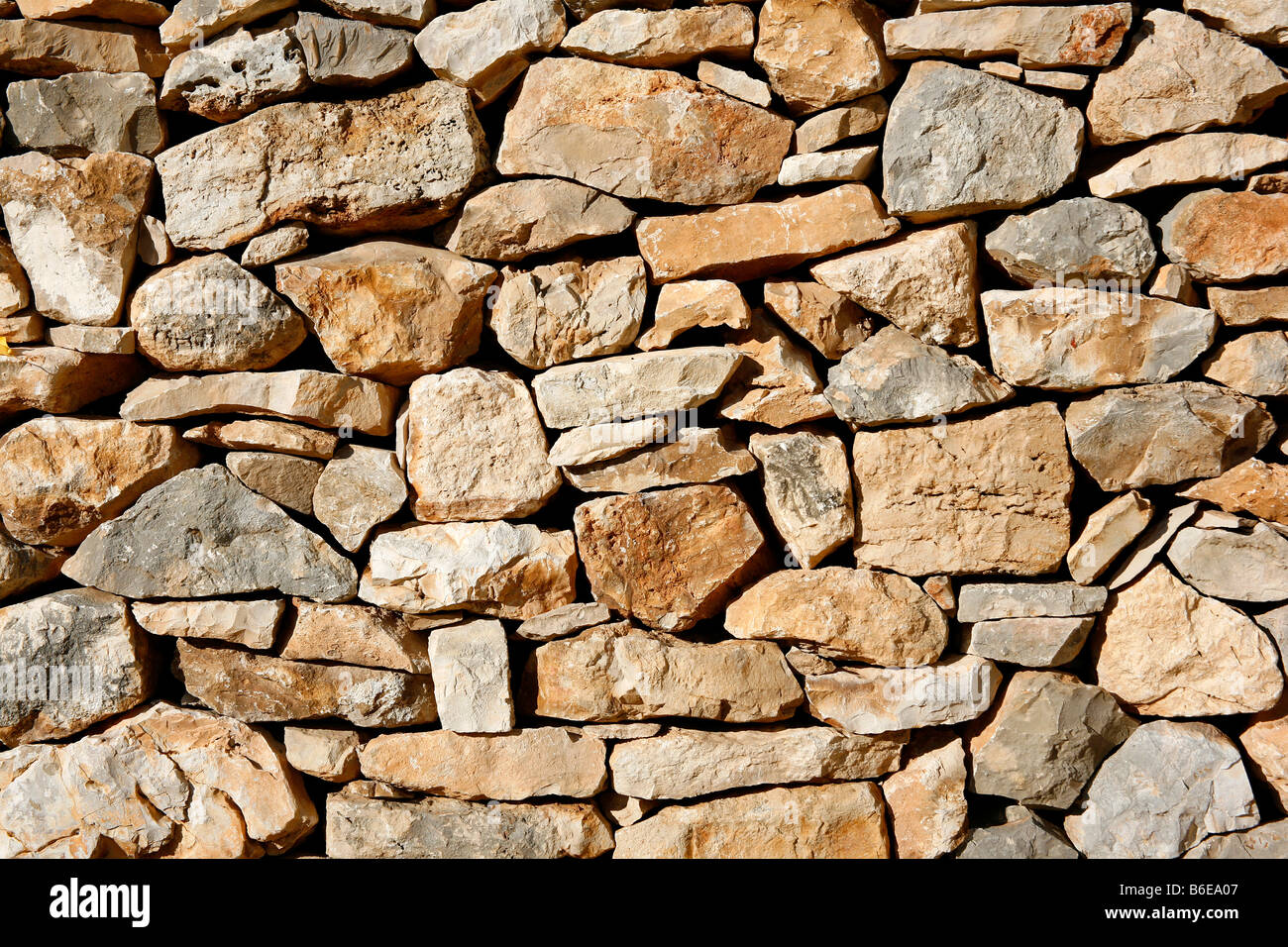 Background of dry limestone wall with rocky structure Stock Photo - Alamy
