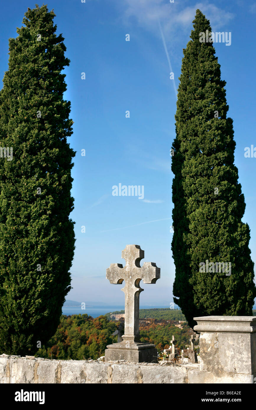 tombstone crosses on blue mediterranean sky with cypresses Stock Photo ...